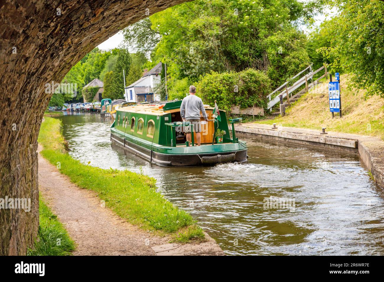 Canal narrowboat passing through the South Wales village of Govilon on ...