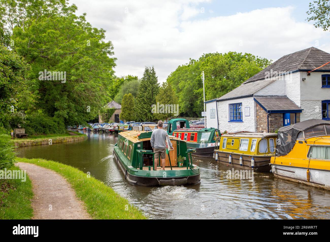 Canal narrowboat passing through the South Wales village of Govilon on ...