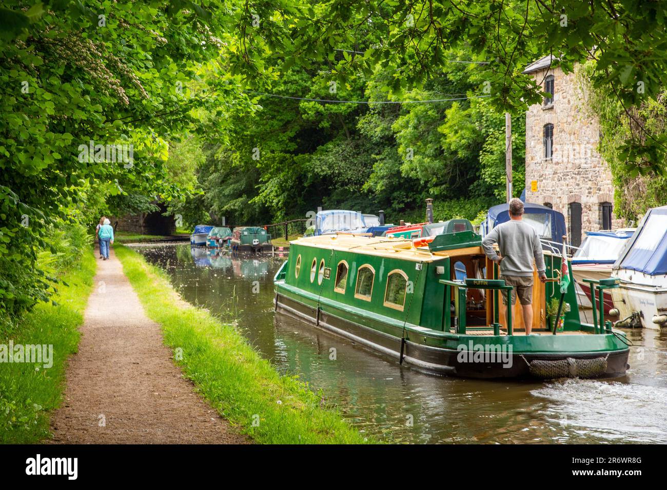 Canal narrowboat passing through the South Wales village of Govilon on ...
