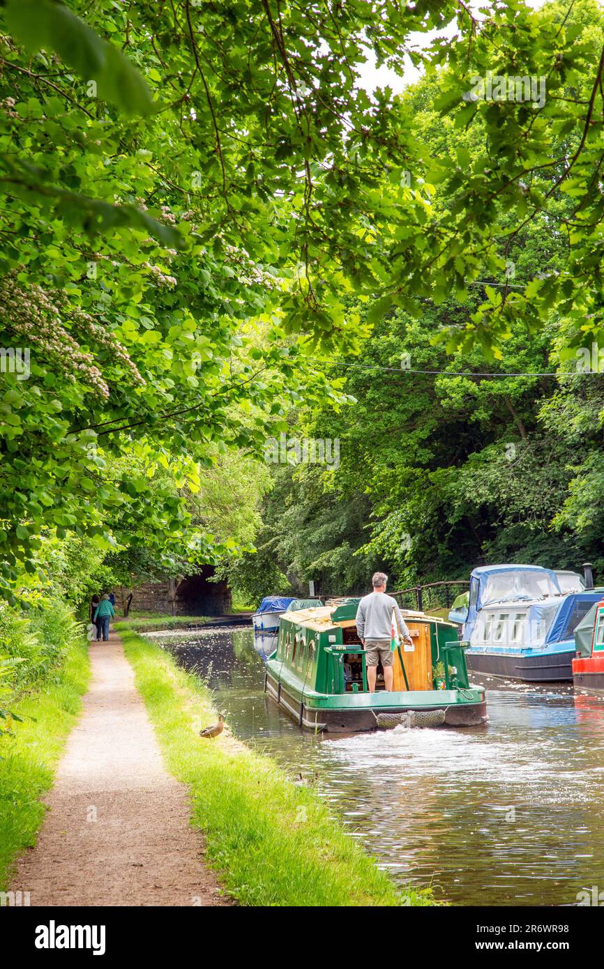 Canal narrowboat passing through the South Wales village of Govilon on ...