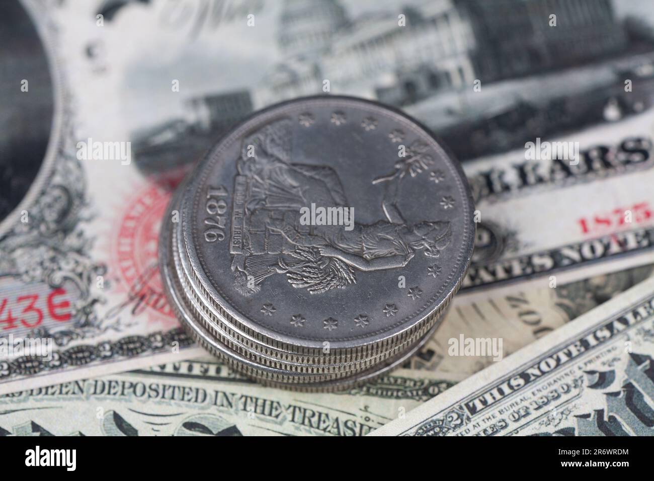 Old west US banknotes and silver certificates with silver dollar coins ...