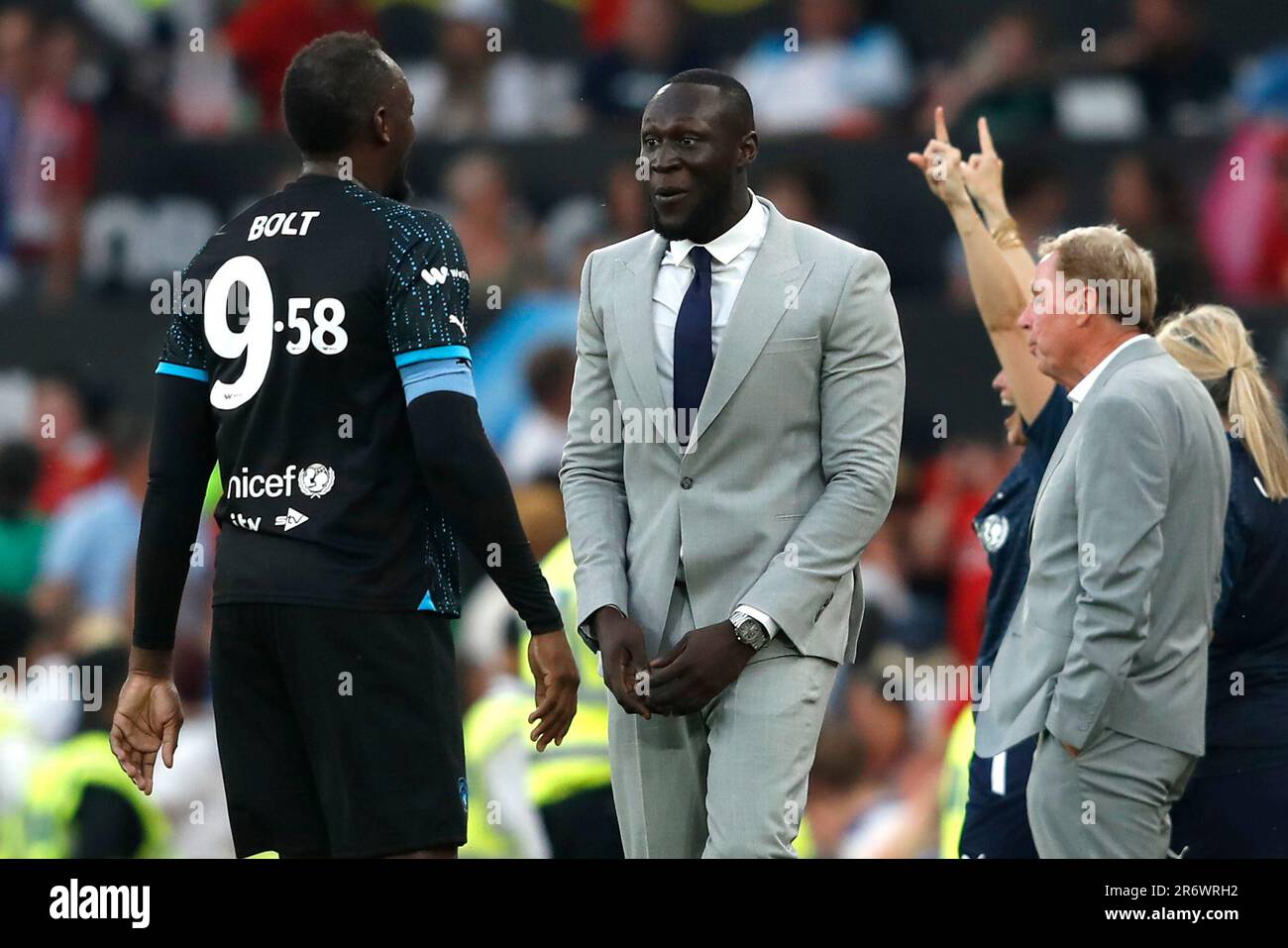 Soccer Aid World XI's Usain Bolt (left) speaks with England coach ...