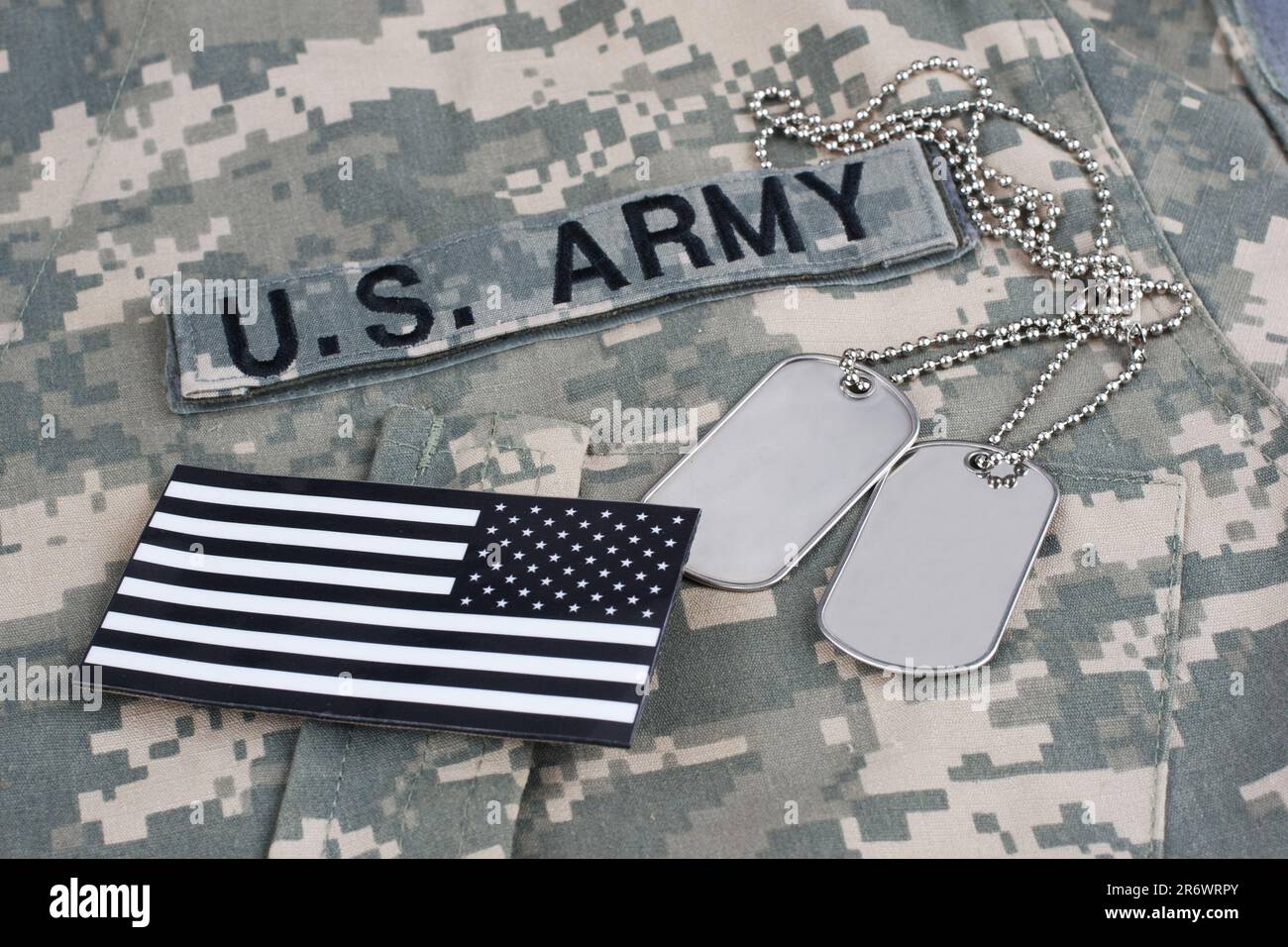 US IR flag patch with dog tags and US ARMY branch tape on camouflage ...