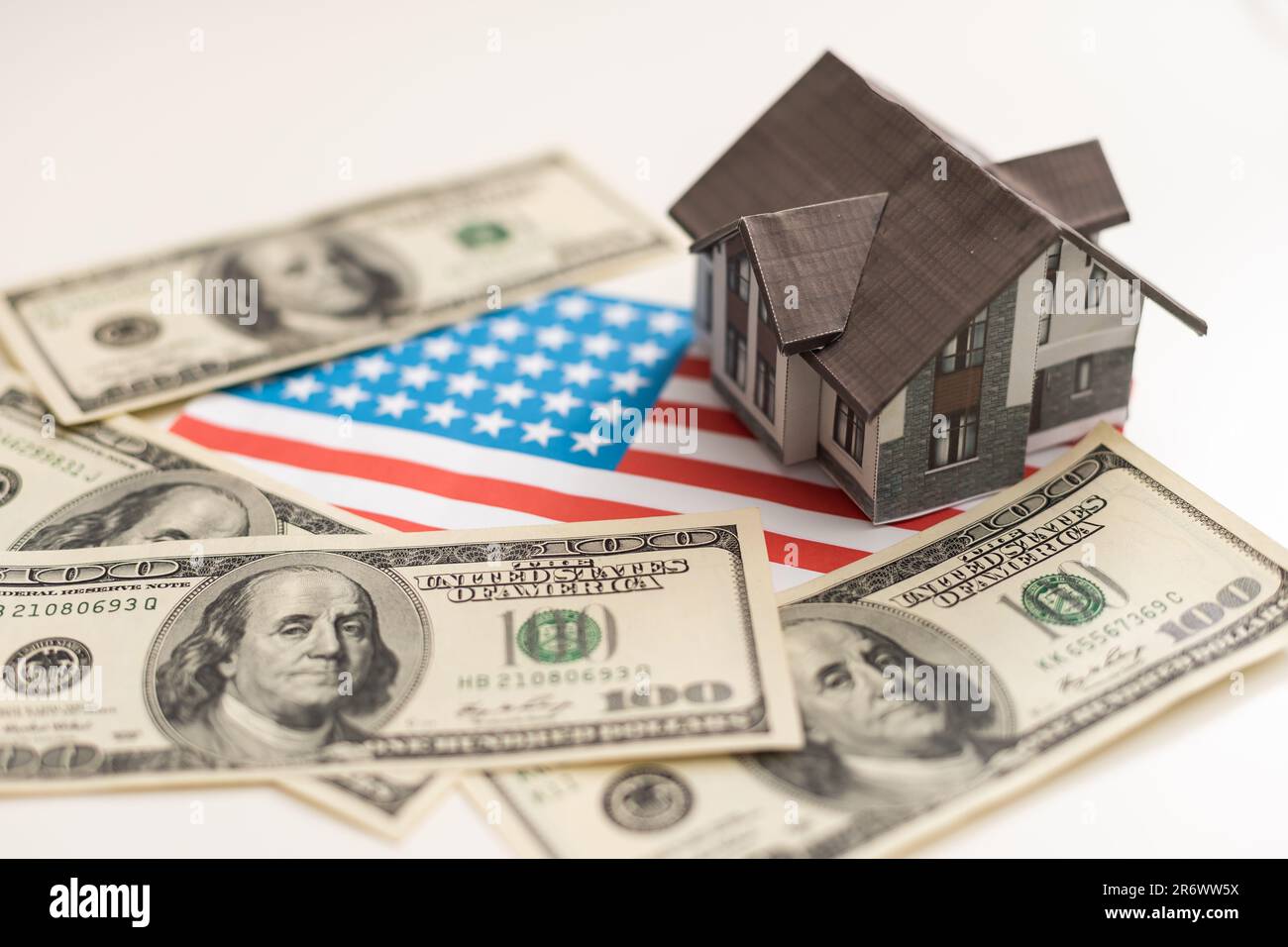 stack of dollar bills and House Stock Photo - Alamy