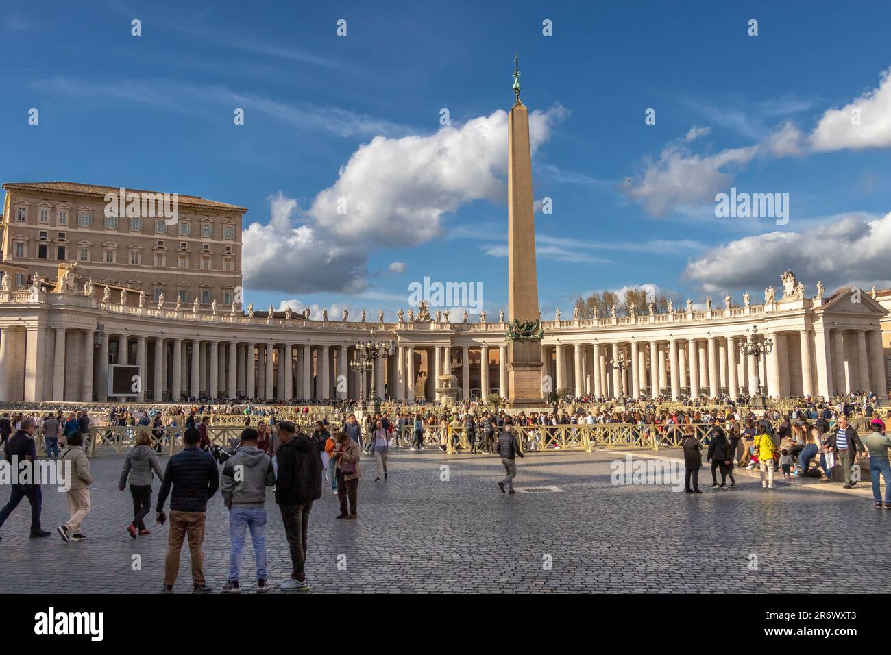 People at St Peter's Square, a large plaza located directly in front of ...
