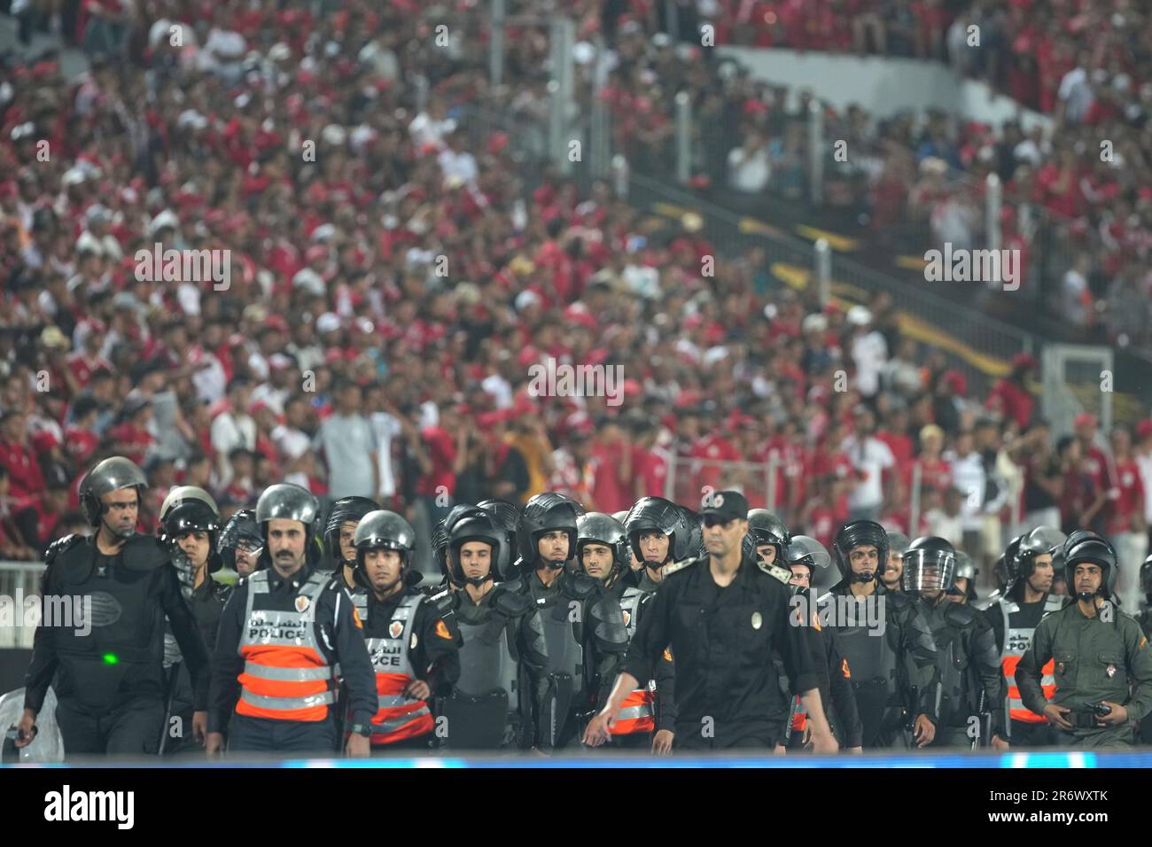 Riots police walk inside the play ground during the CAF Champions ...