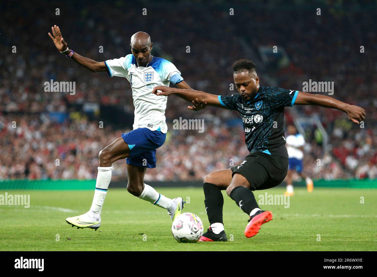 England's Sir Mo Farah (left) and Soccer Aid World XI's Patrice Evra ...