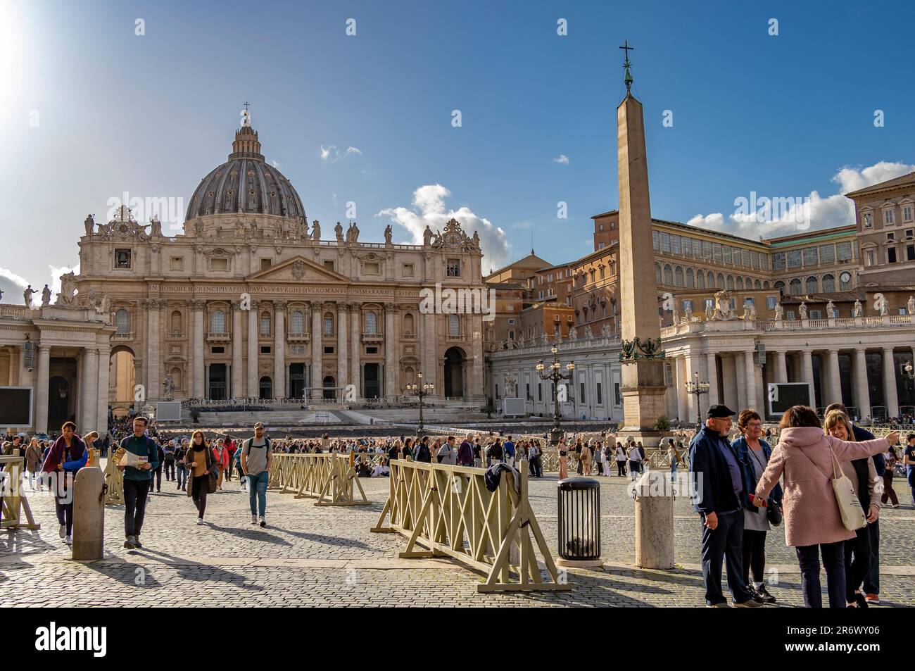 People at St Peter's Square, a large plaza located directly in front of ...