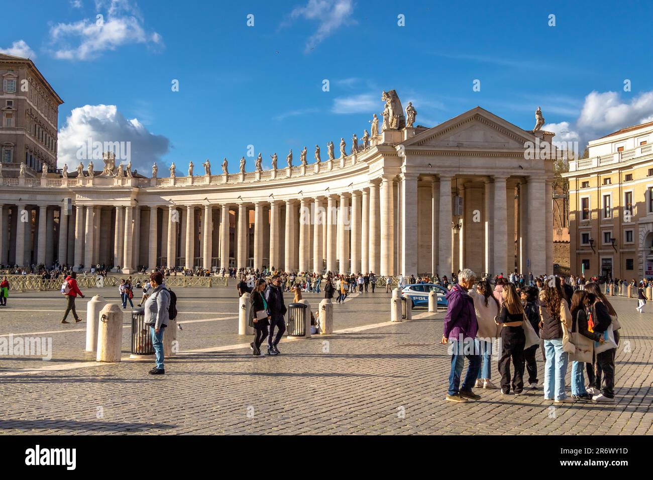 People at St Peter's Square, a large plaza located directly in front of ...