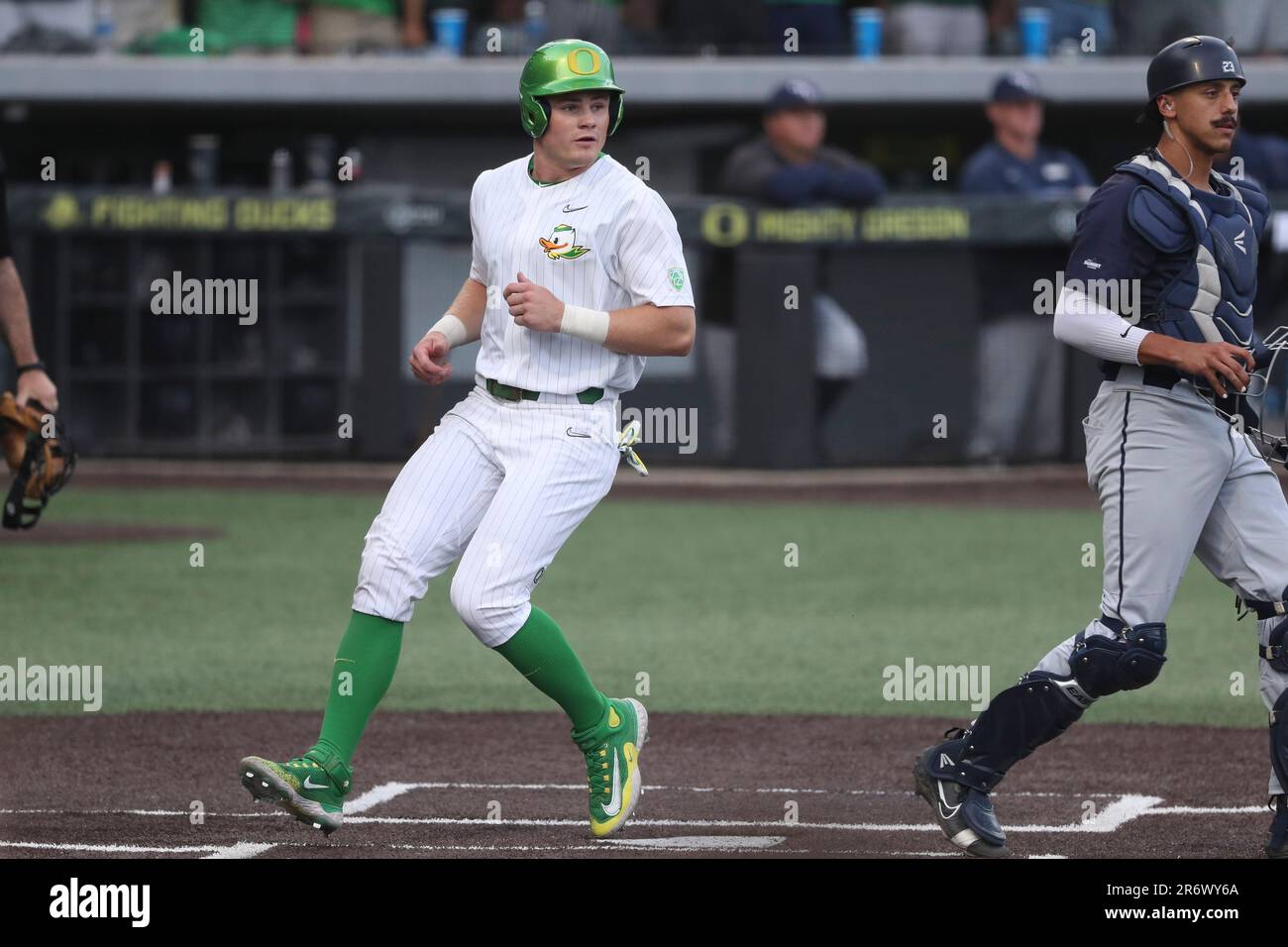 Oregon outfielder Bryce Boettcher (28) scores a run against Oral ...