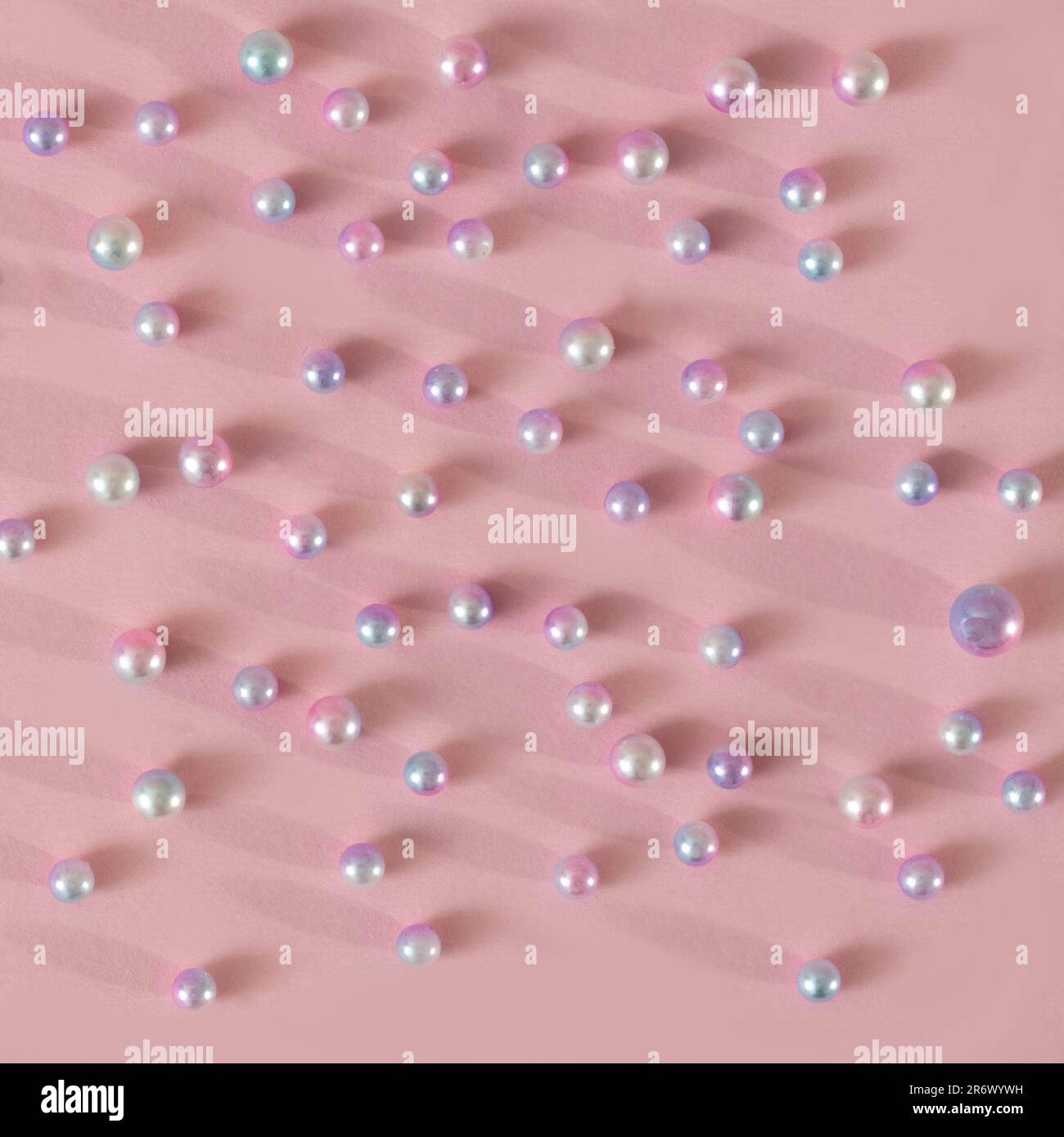 Shiny pastel pink and white pearls on pastel pink background. Elegant ...