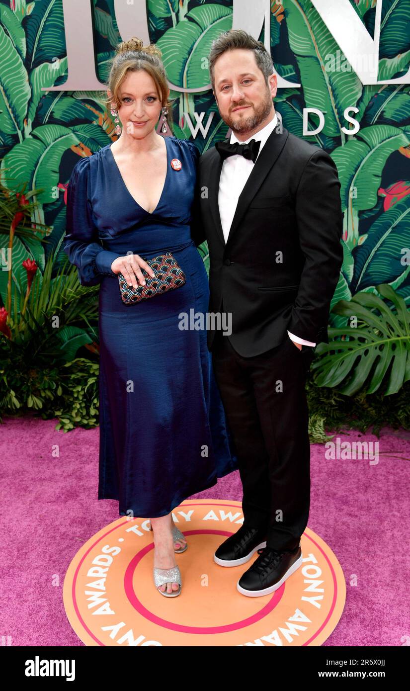 Jessica Stone, wearing a pin in support of the WGA strike, left, and ...
