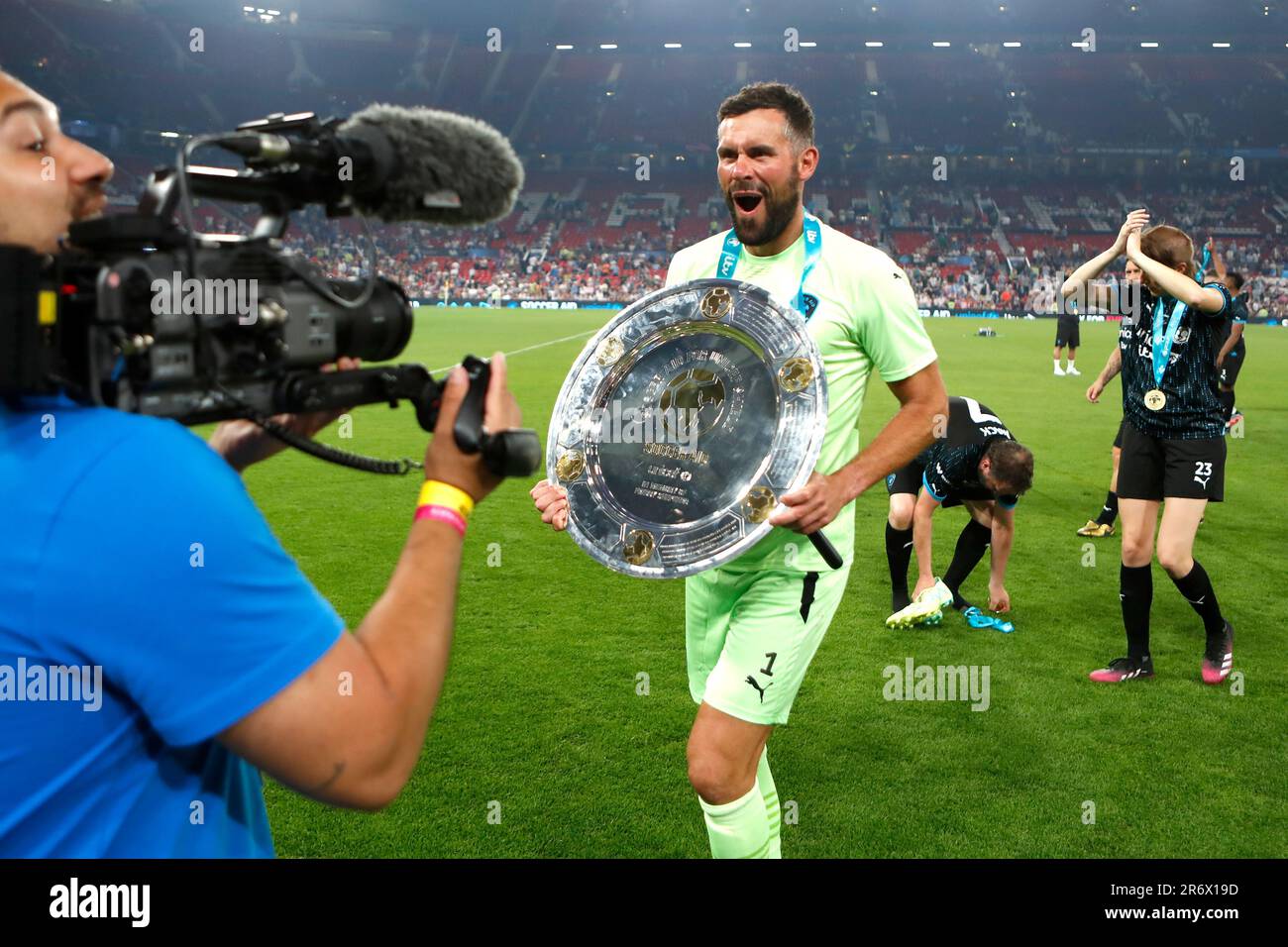 Soccer Aid World XI goalkeeper Ben Foster with the trophy, following ...