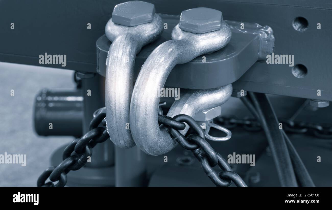 Metal shackle with chain for lifting or towing heavy objects in the ...