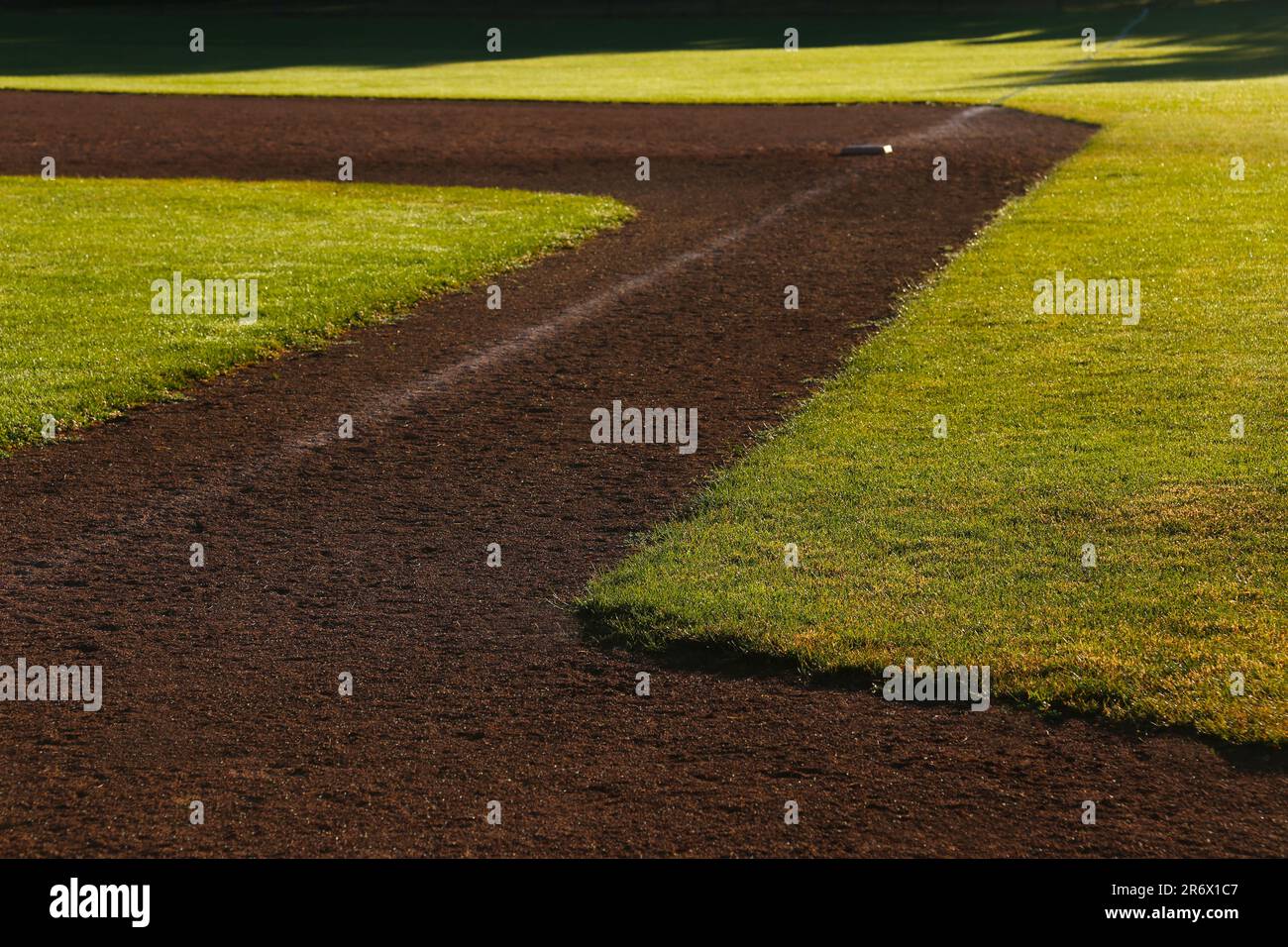 The first base on baseball field shot in the early morning Stock Photo ...