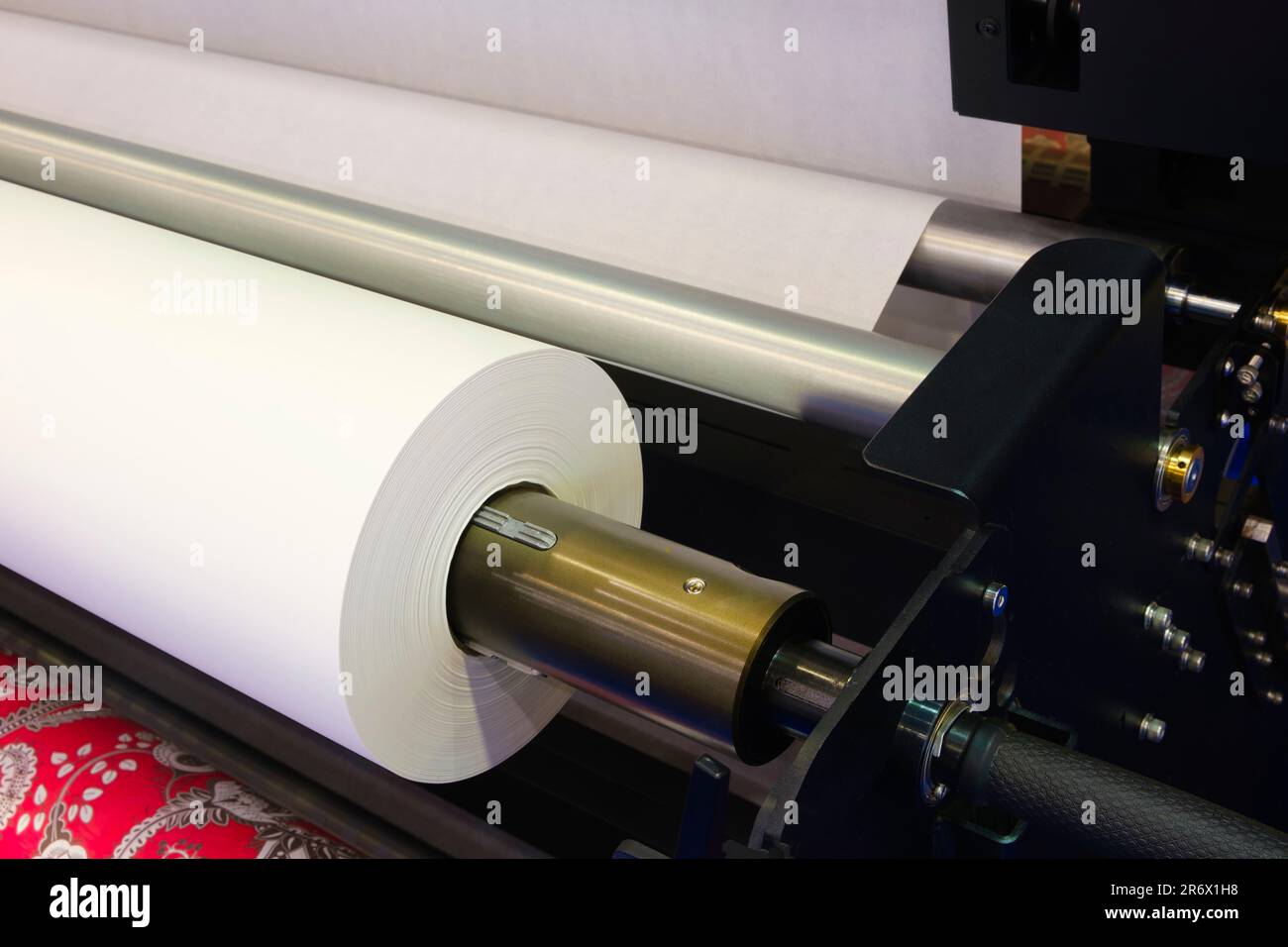 Rolls paper and fabric in wide industrial plotter Stock Photo - Alamy