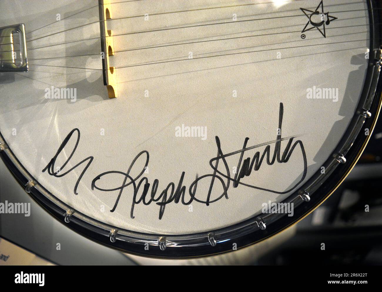 An autographed banjo played by bluegrass pioneer Ralph Stanley on ...