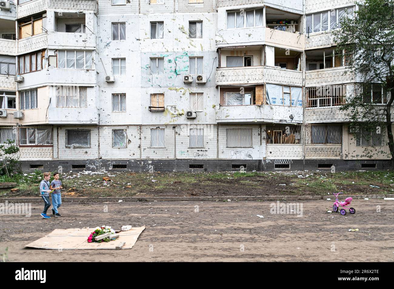 Kids play in a blast crater in Odesa, Ukraine the day after the drone ...