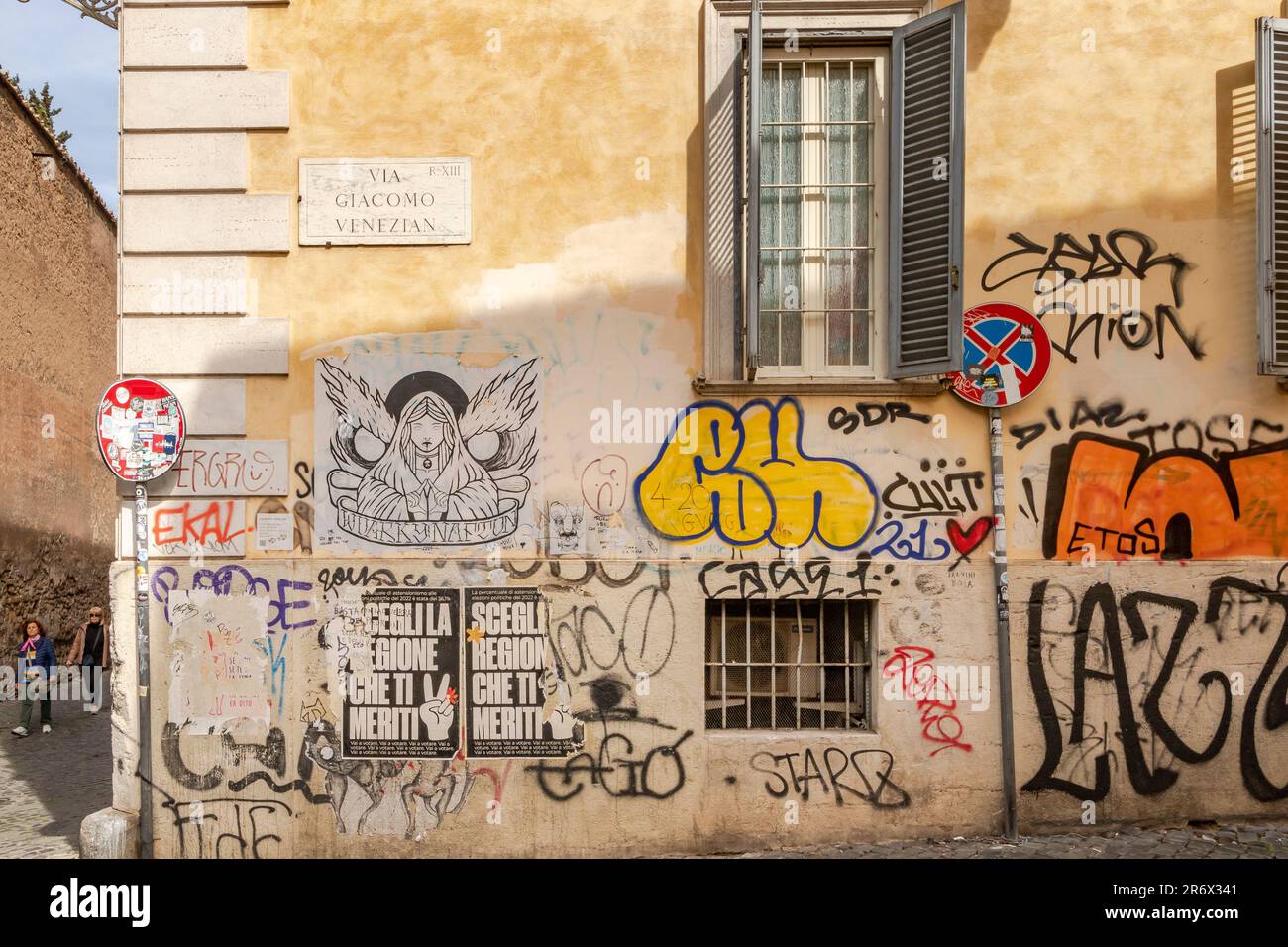 Graffiti and spray paint on the wall of a building in Trastevere, Rome ...