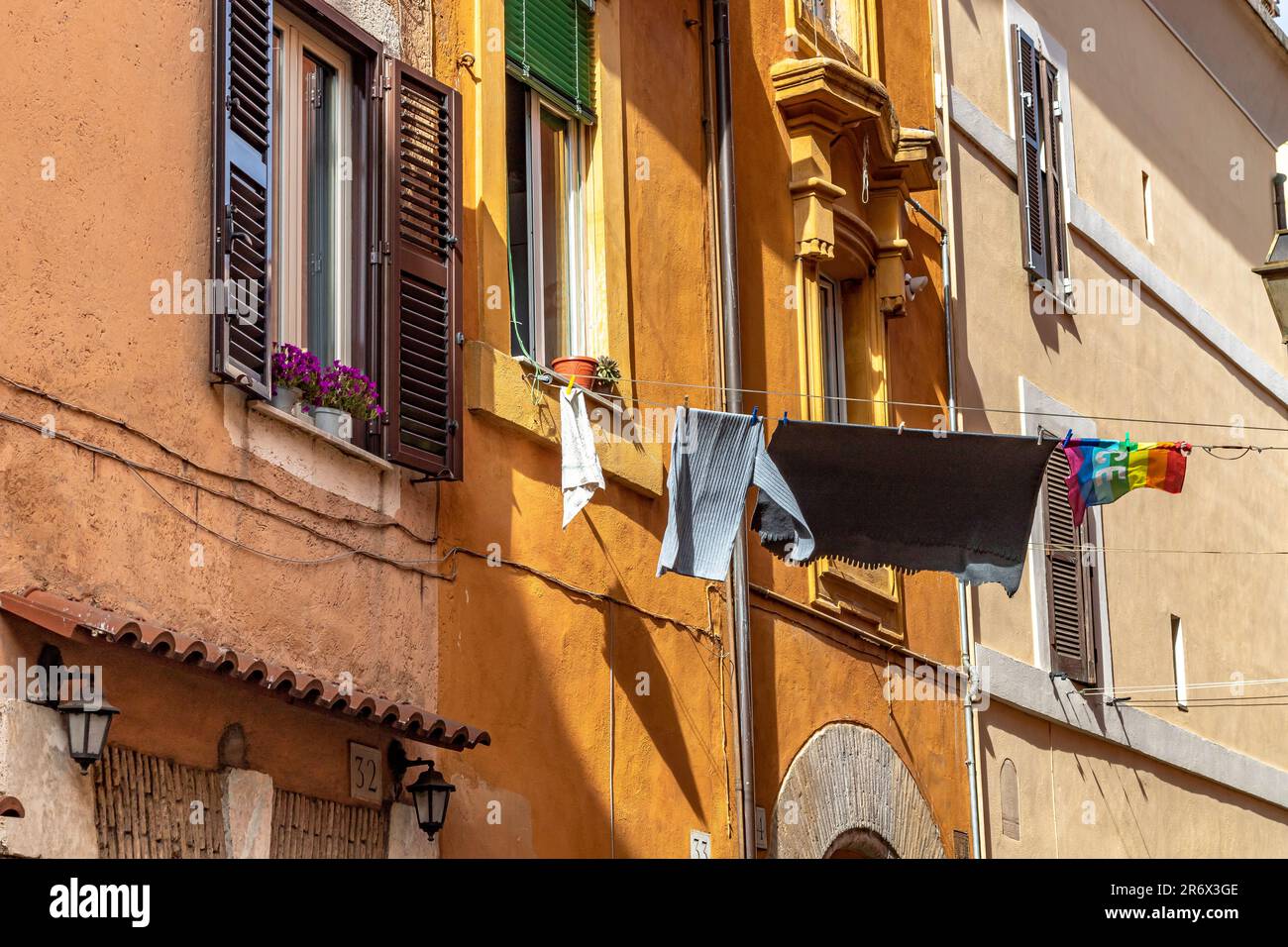 Washing hanging on a washing line strung between buildings on Vicolo ...