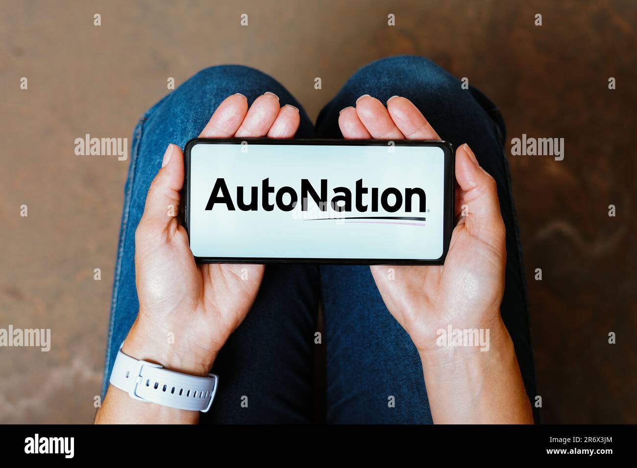 In this photo illustration, the AutoNation logo is displayed on a ...