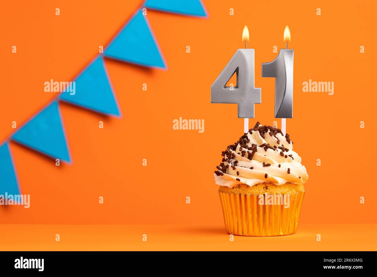 Candle number 41 - Cake birthday in orange background Stock Photo - Alamy