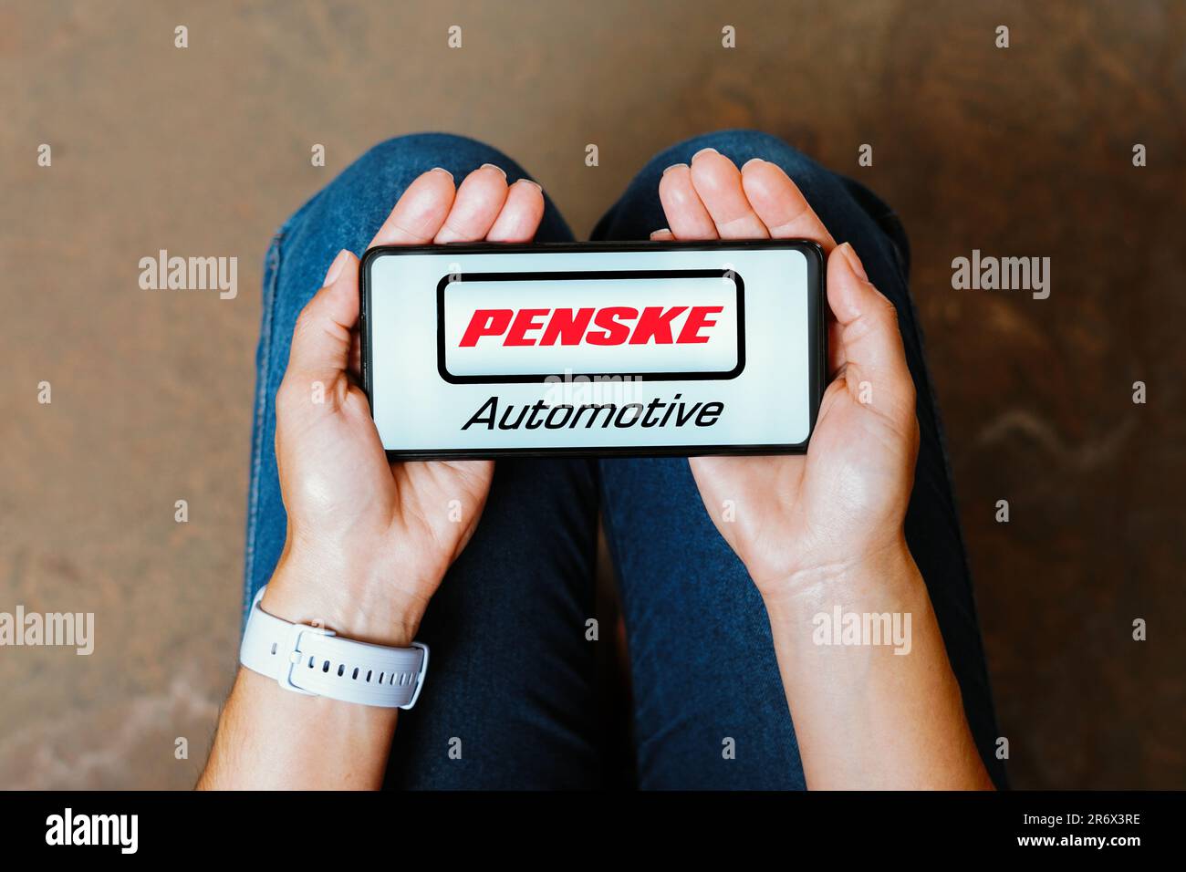 In this photo illustration, the Penske Automotive Group logo is ...