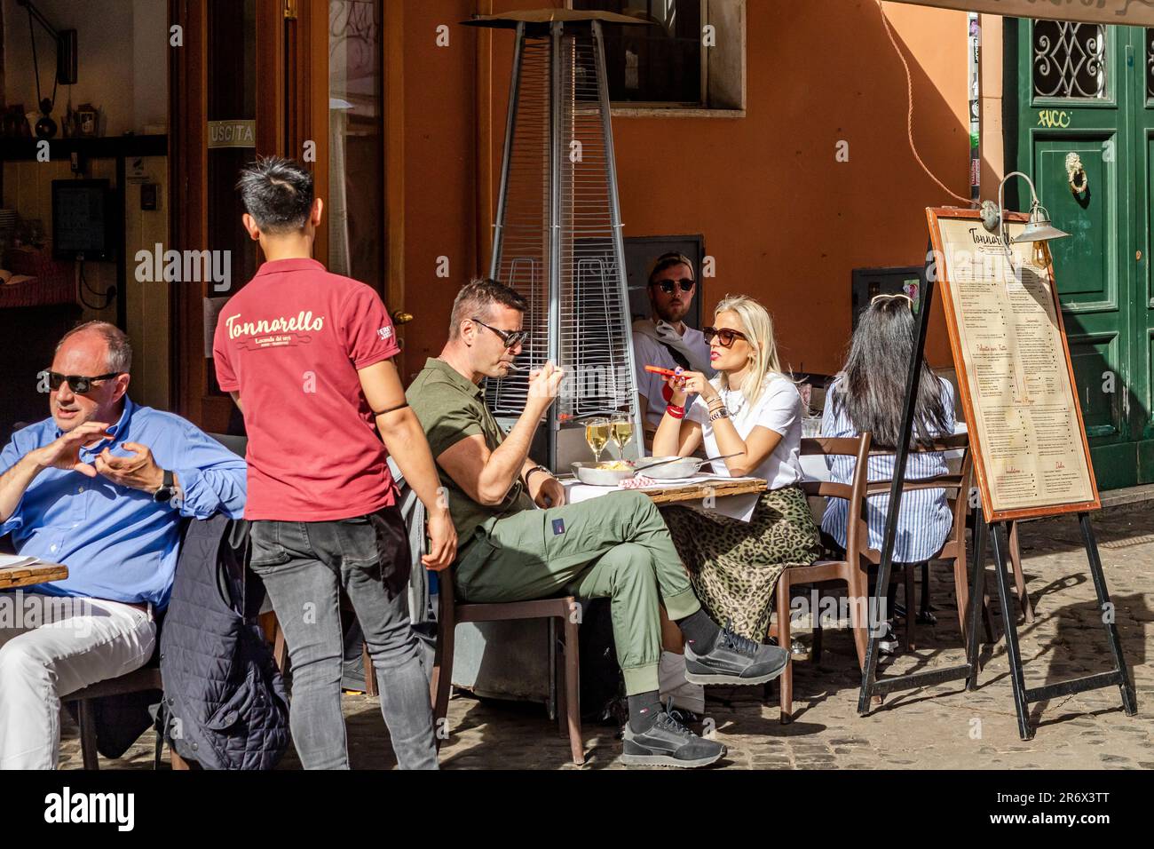 People dining outside in the sunshine at Tonnarello a popular ...