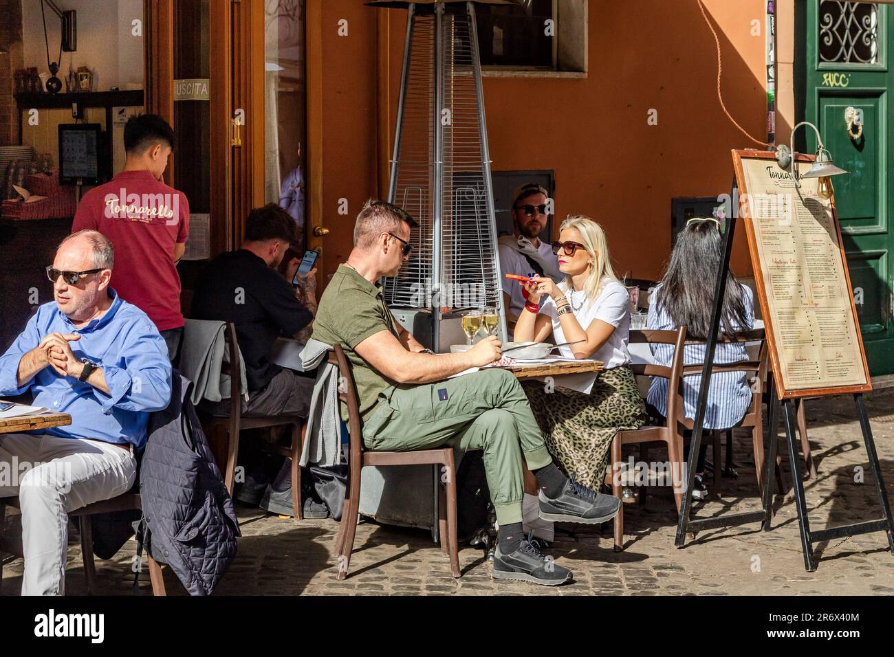 People dining outside in the sunshine at Tonnarello a popular ...