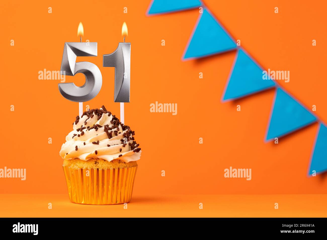 Candle number 51 - Cake birthday in orange background Stock Photo - Alamy