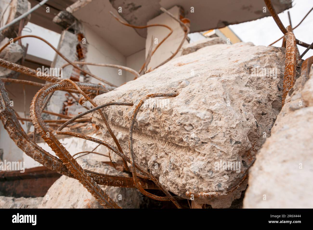 Image of a building under demolition. Concrete, bricks and steel beams ...