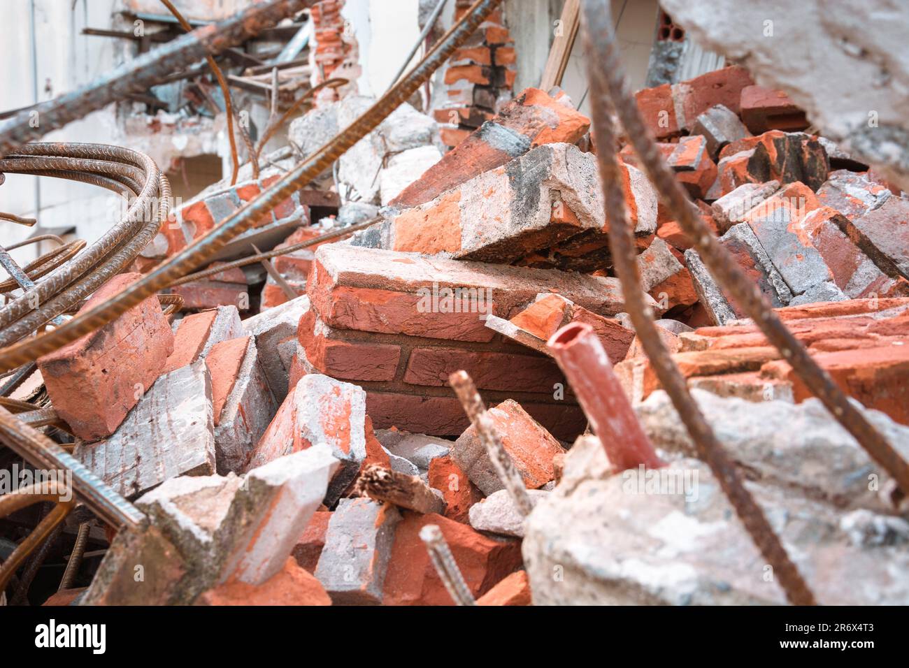 Image of a building under demolition. Concrete, bricks and steel beams ...