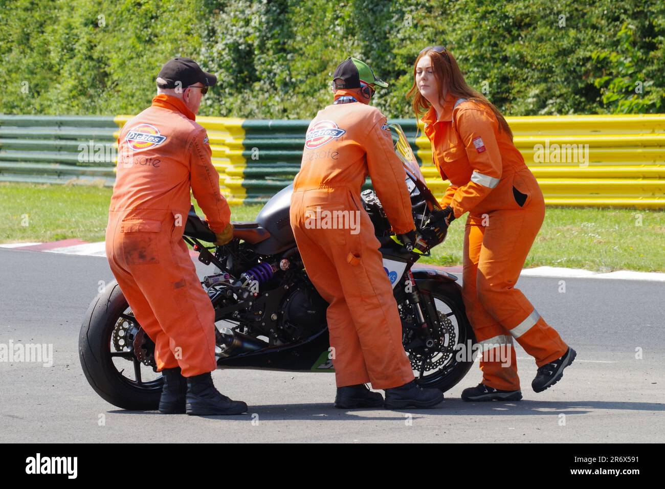 Croft Circuit, 10 June 2023. Marshalls removing a crashed Kawasaki 650 ...