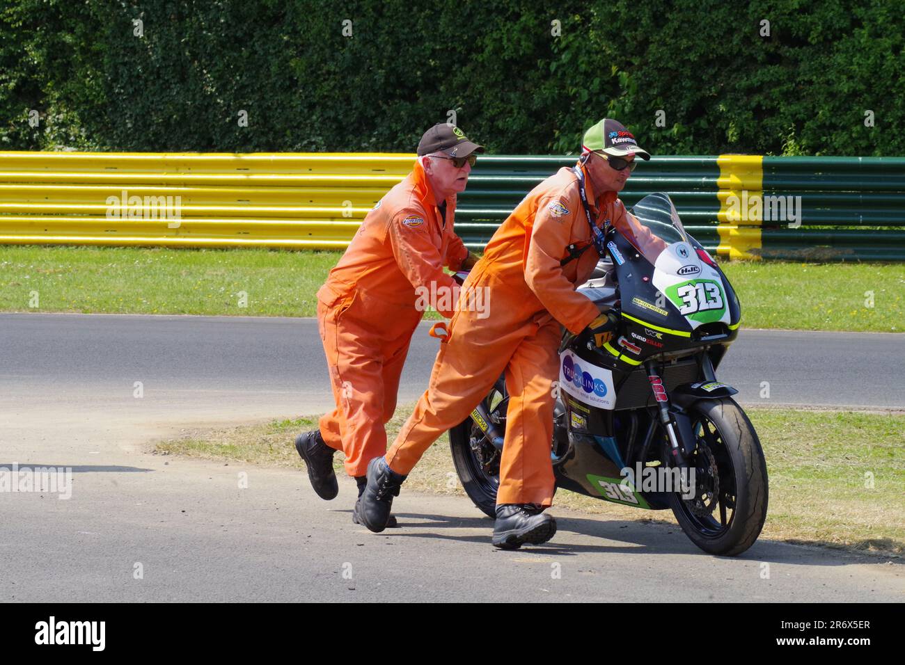 Croft Circuit, 10 June 2023. Marshalls removing a crashed Kawasaki 650 ...