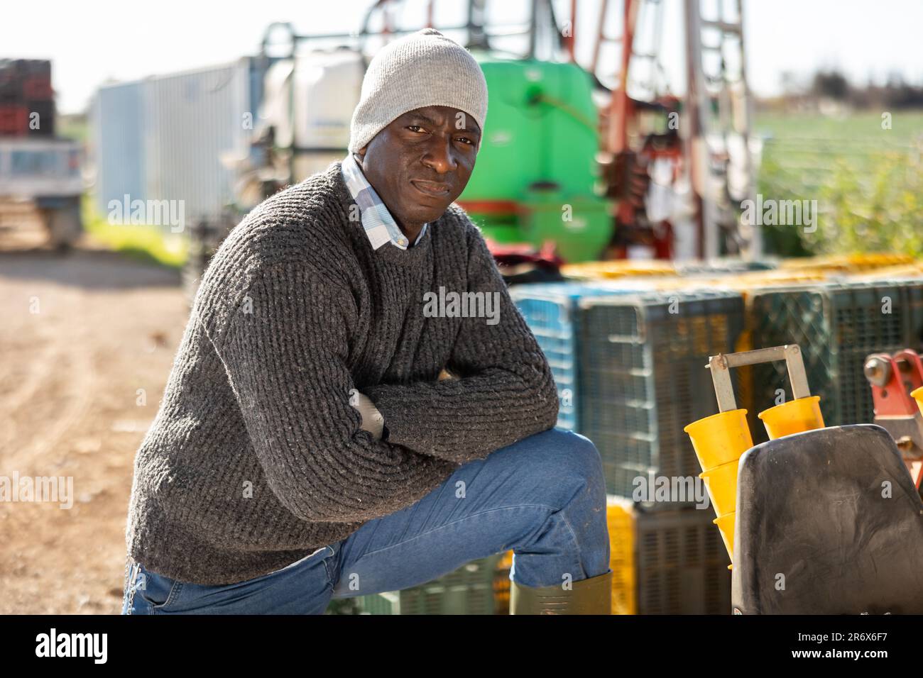 Male tractor driver in farm backyard Stock Photo - Alamy