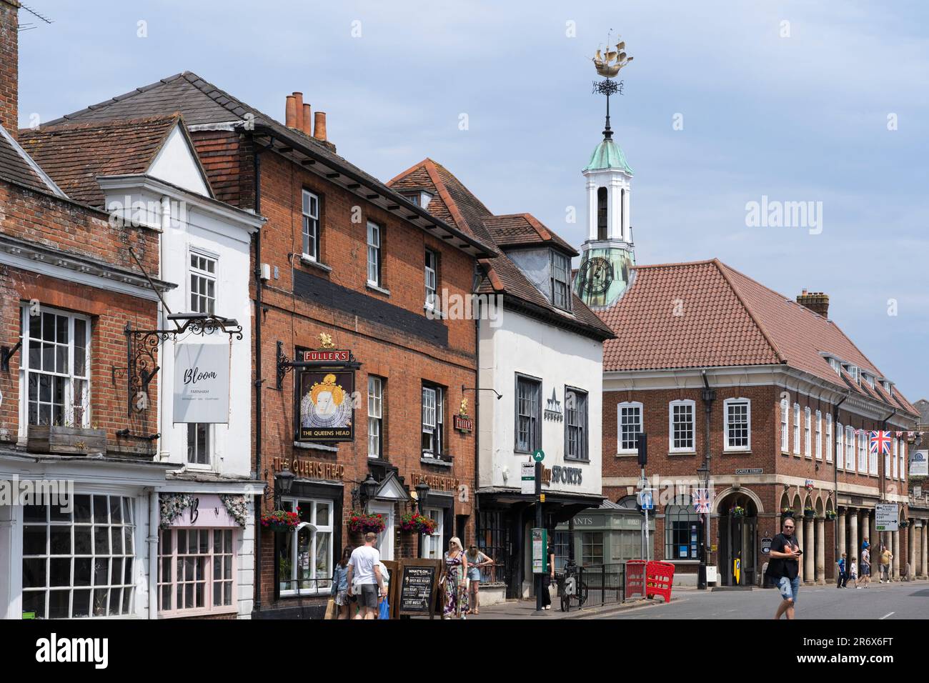 Visitors and tourists to Farnham walking along The Borough, with ...