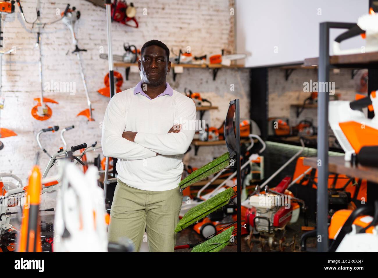 Portrait of african american salesman at tools store Stock Photo - Alamy