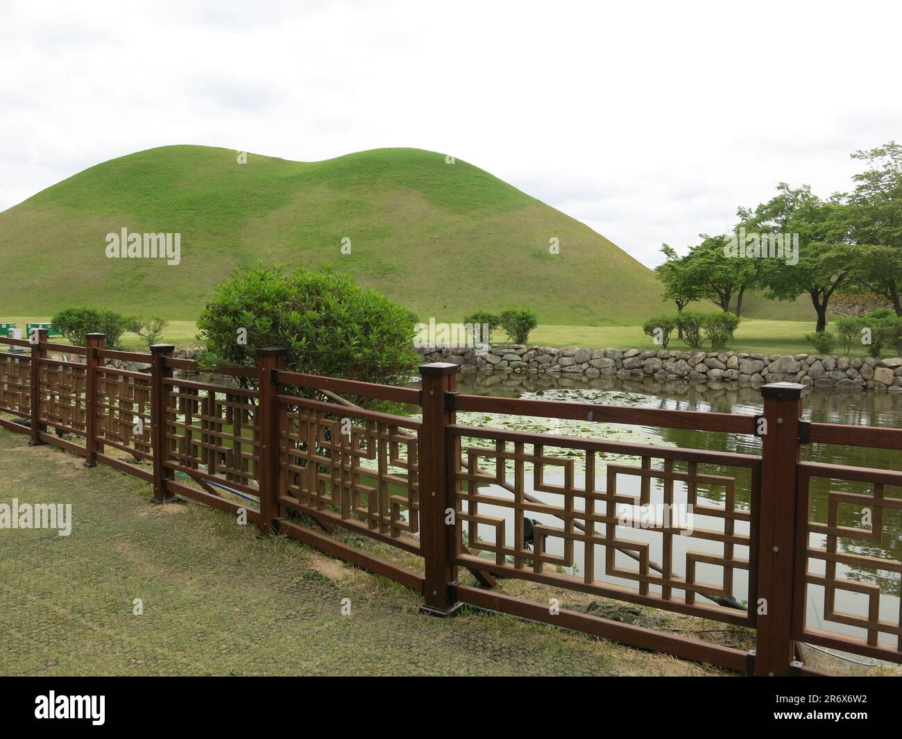 View Of The Grassy Hillocks And Lake Within The Tumuli Park Gyeongju Where Royal Tombs From
