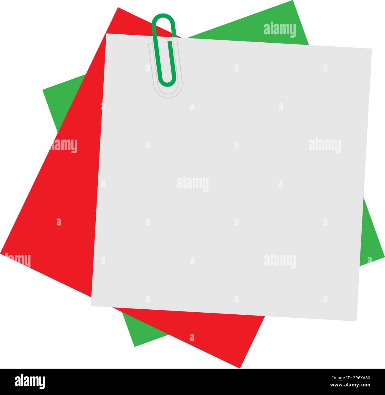 Sheets of paper connected by a green paper clip on a white background ...