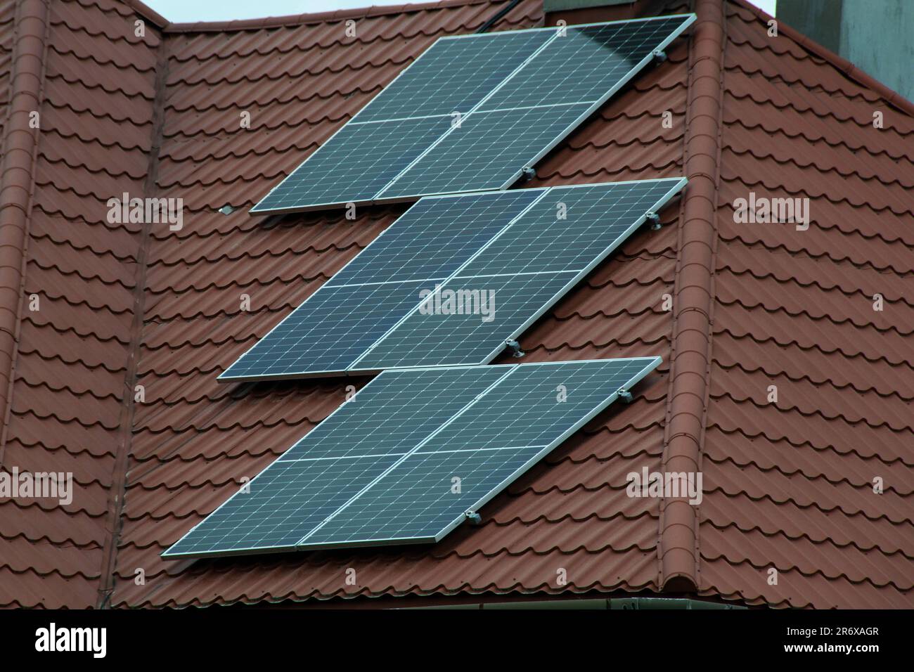 Installing a Solar Cell on a Roof. Solar panels on roof. Historic farm ...