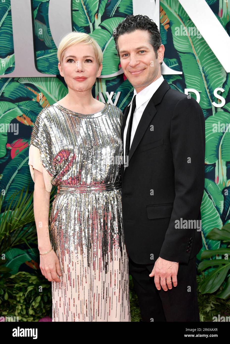 Michelle Williams, left, and Thomas Kail arrive at the 76th annual Tony ...