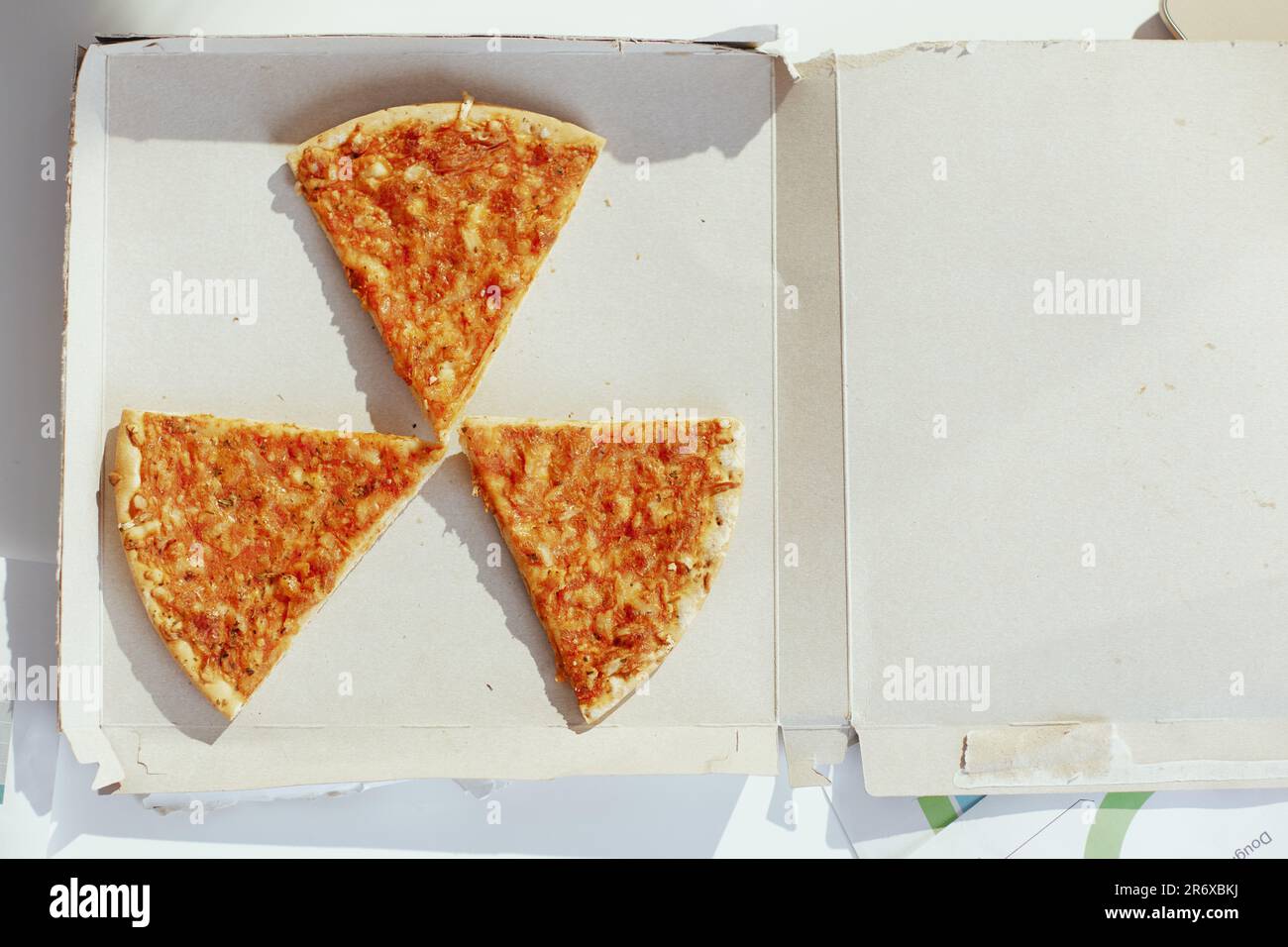 Upper view of pizza at the table in radiation sign Stock Photo - Alamy