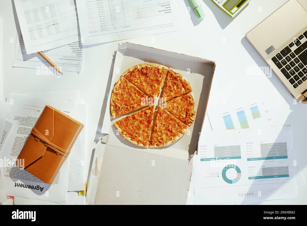 Office eating pizza slice desk hi-res stock photography and images - Alamy