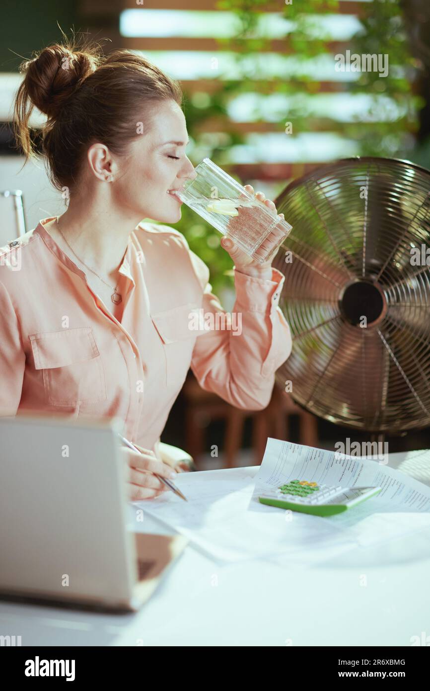 Sustainable workplace. smiling modern female employee at work with ...