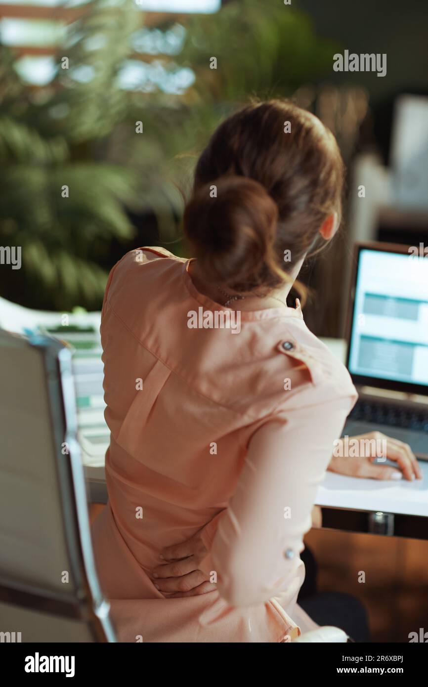 Woman back pain desk hi-res stock photography and images - Alamy