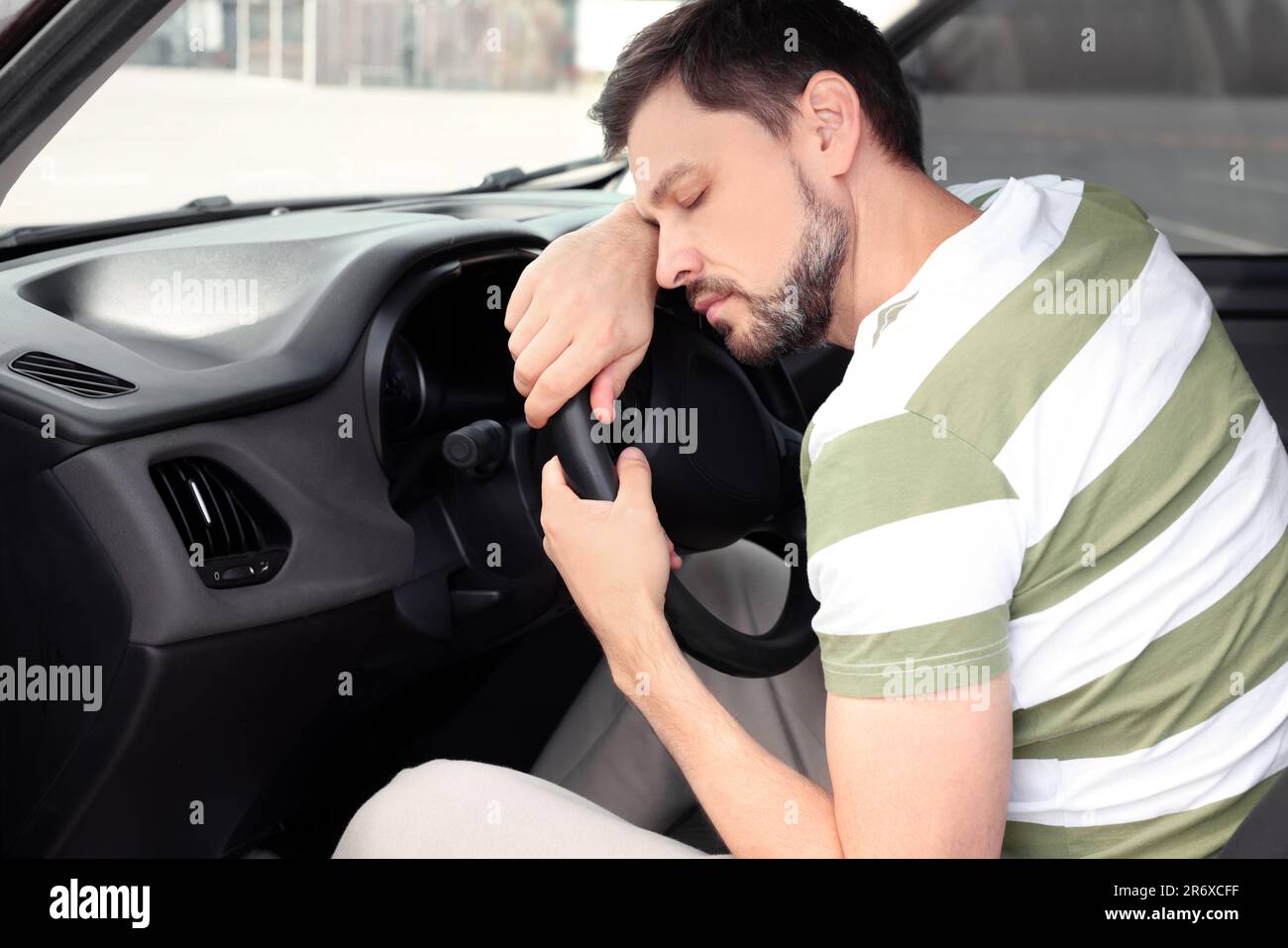 Tired handsome man sleeping in his modern car Stock Photo - Alamy