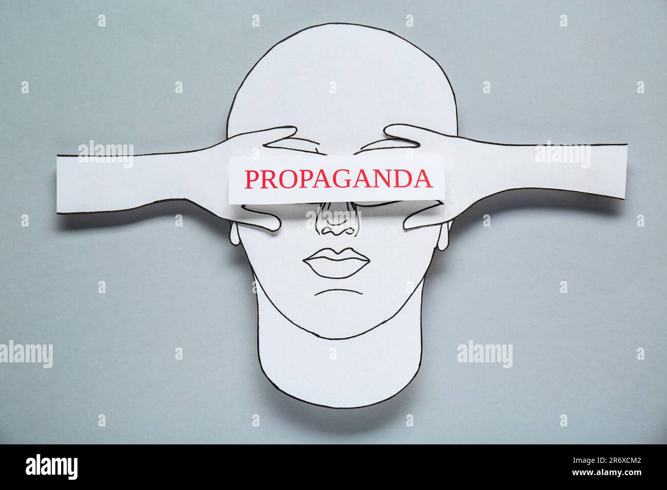 Information warfare. Human closing eyes with hands and card with word ...