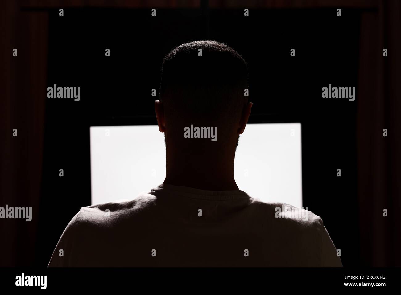 Man using computer at night, back view. Internet addiction Stock Photo ...