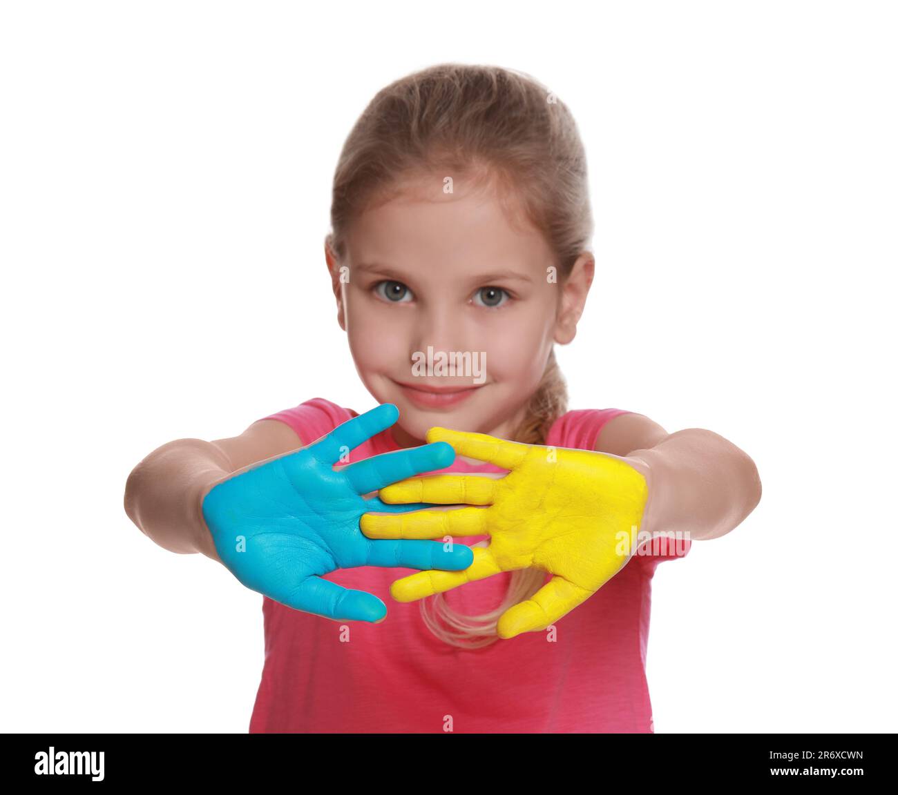 Little girl with hands painted in Ukrainian flag colors against white ...