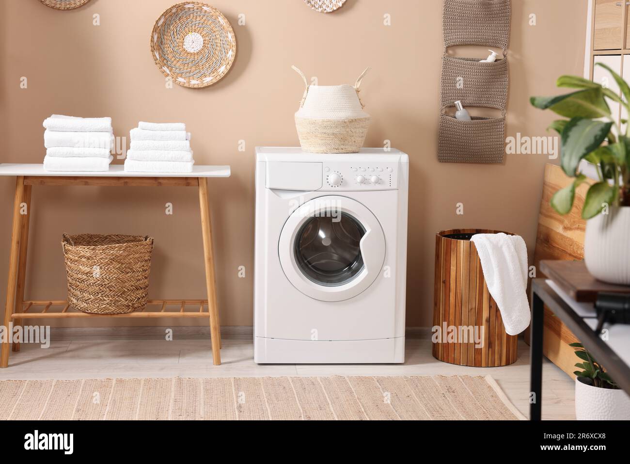 Stylish laundry room with modern washing machine. Interior design Stock ...